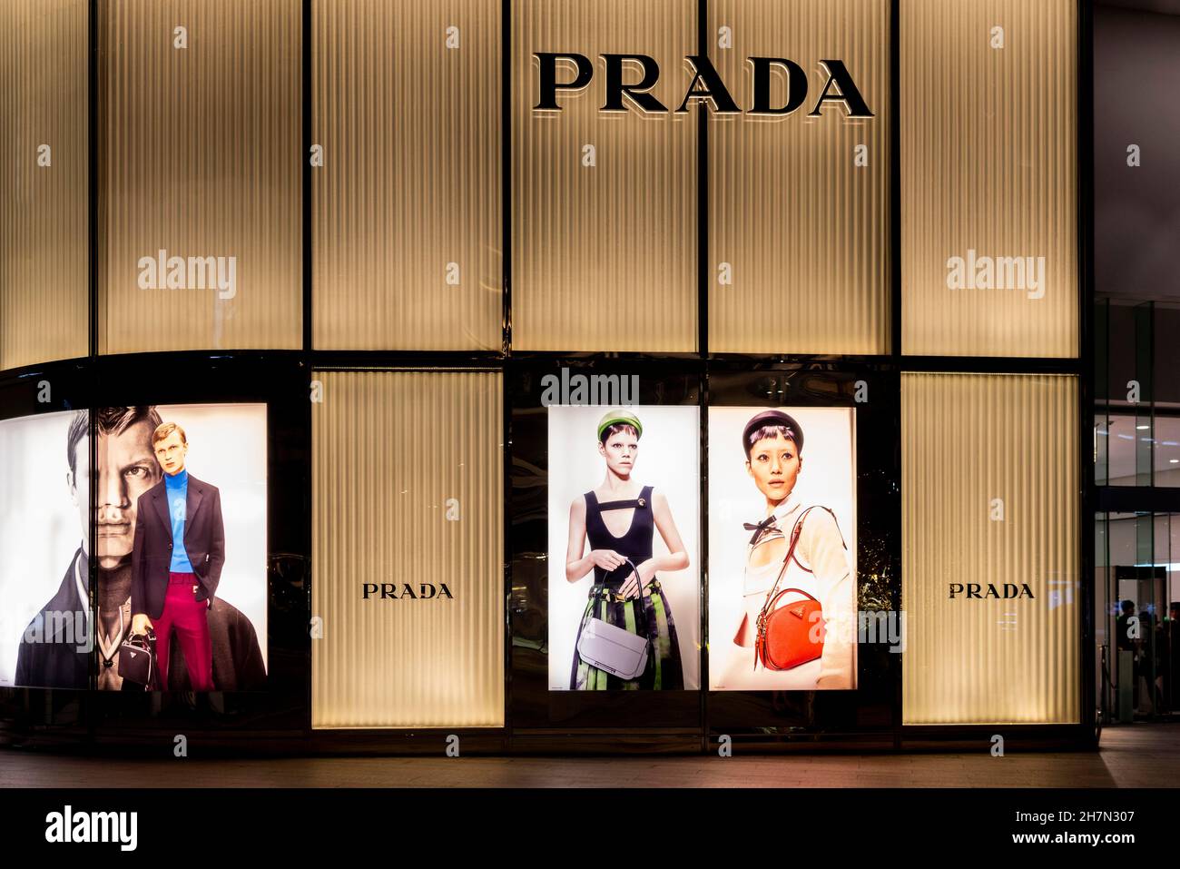 Prada shop window illuminated Stock Photo - Alamy