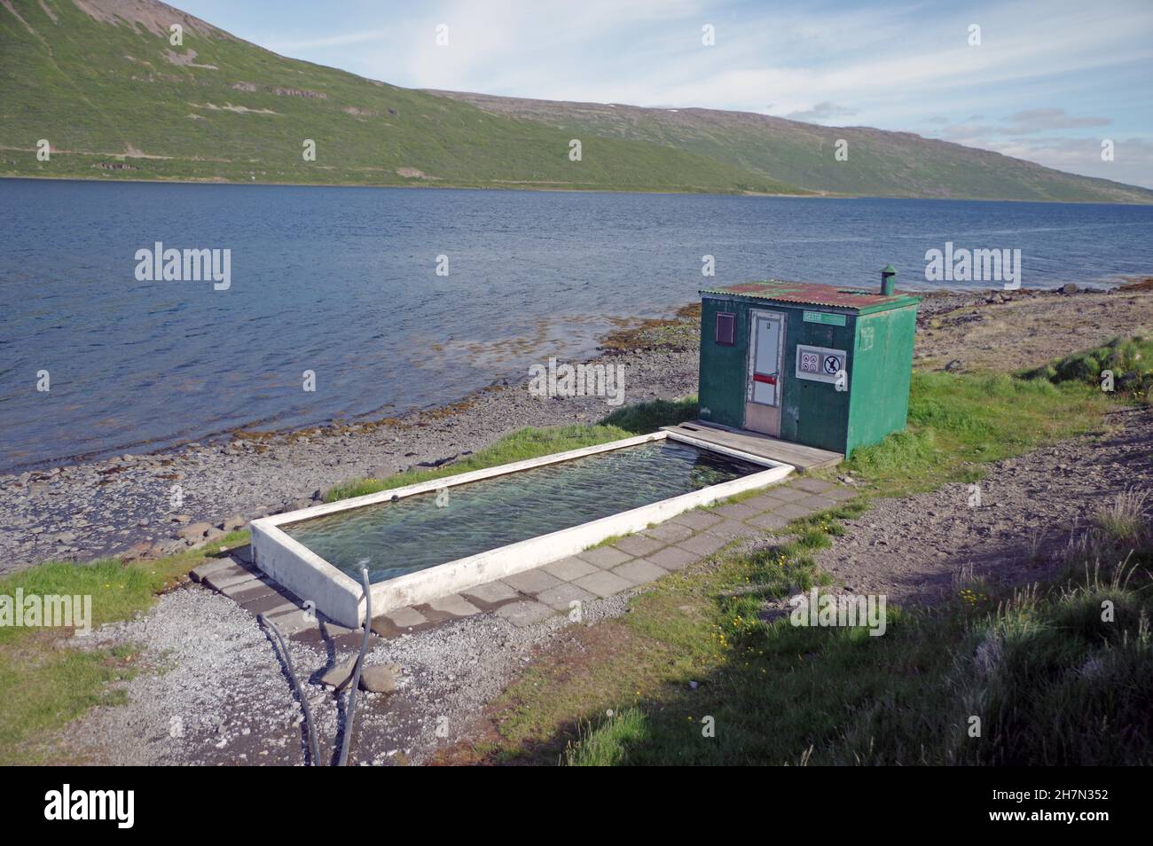 Small pool and fjord, geothermal energy, East Fjords, Iceland Stock ...