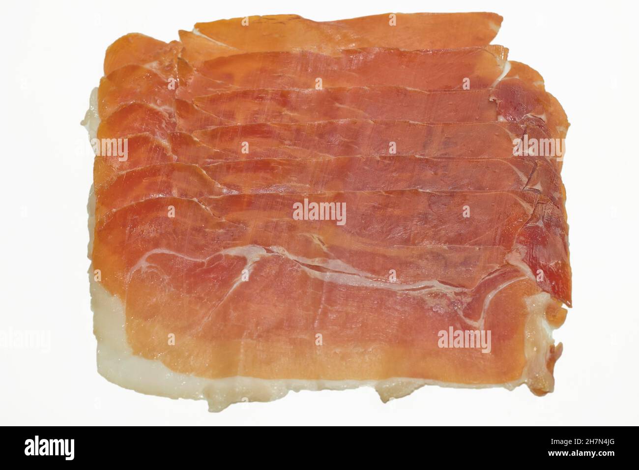 Thinly sliced Spanish Serrano ham, studio photography with white ...