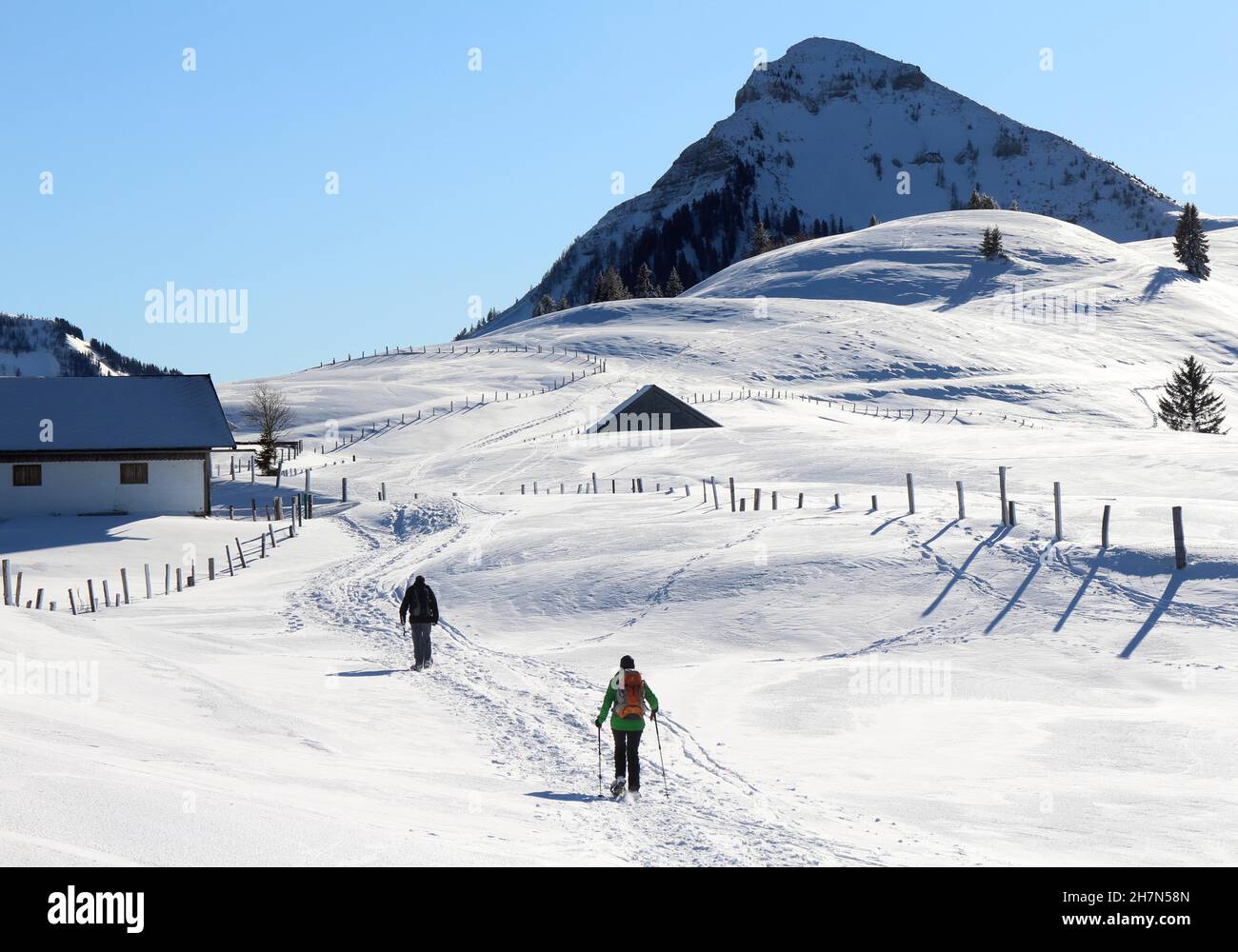 Snowshoe tour in wintry mountain landscape in fantastic weather ...