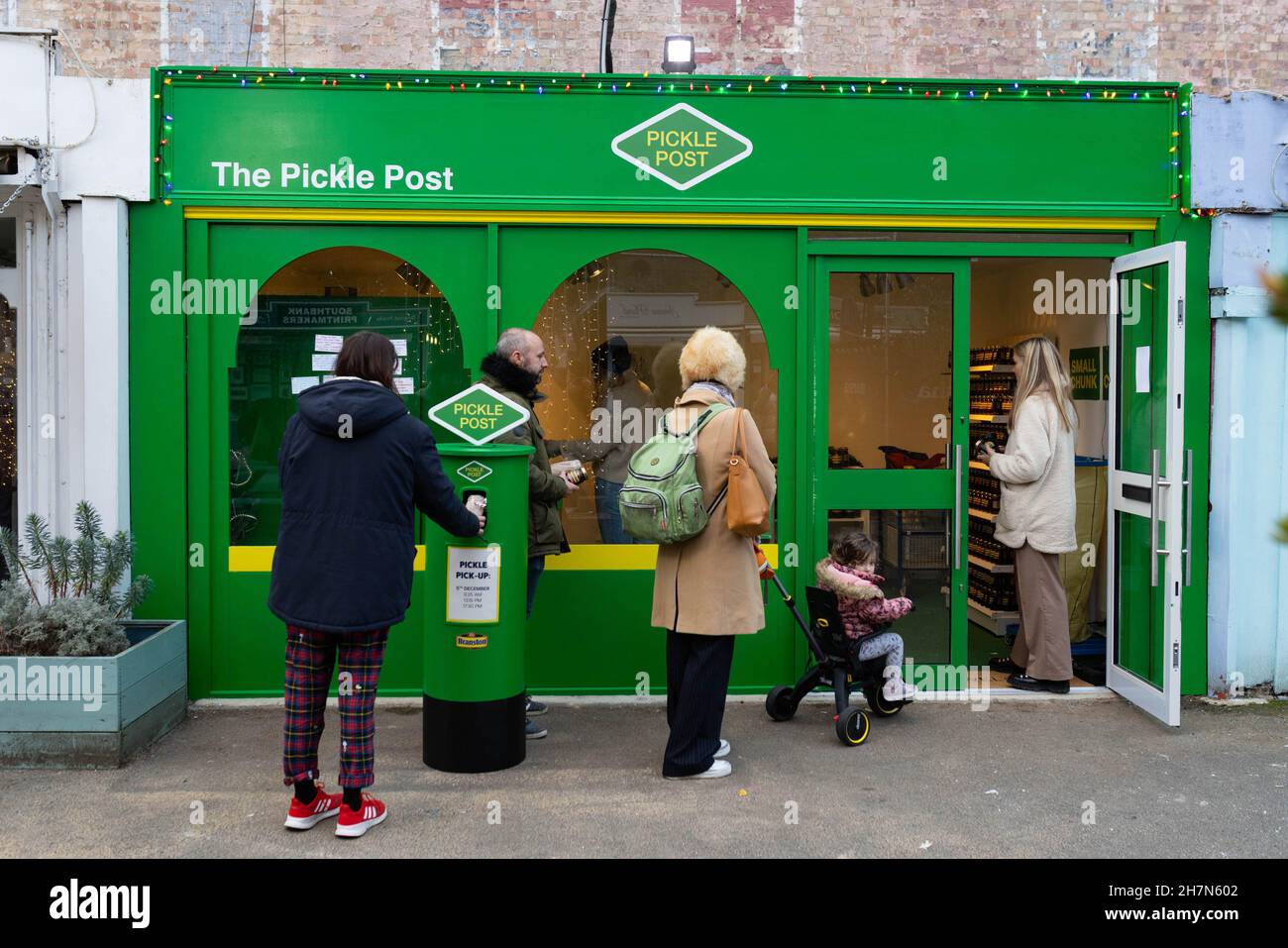 EDITORIAL USE ONLY Members of the public queue outside of the UK's ...