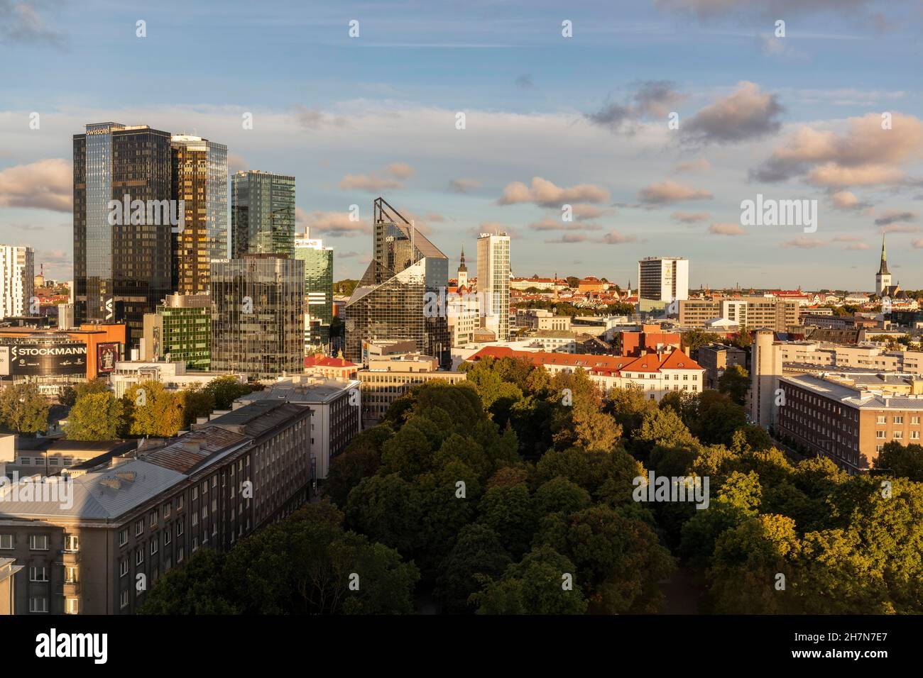 View over the municipal park to the modern buildings, Tallinn city ...