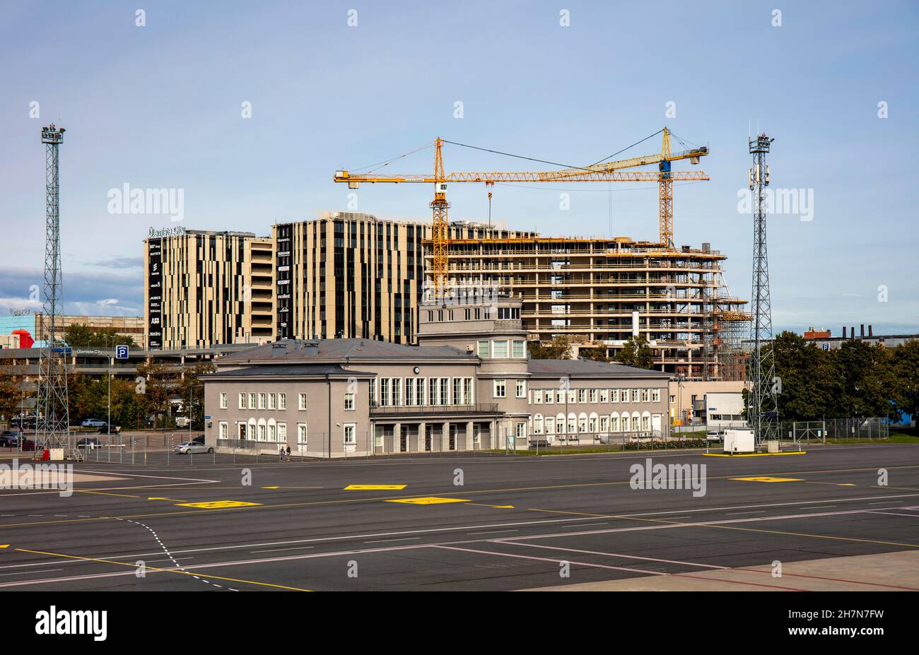 Old, former airport building, behind it construction site of modern ...