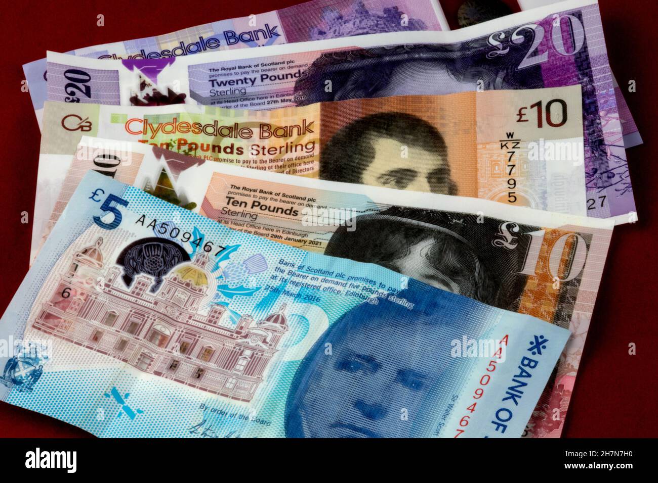 Assorted scottish banknotes isolated on a red table cloth Stock Photo ...