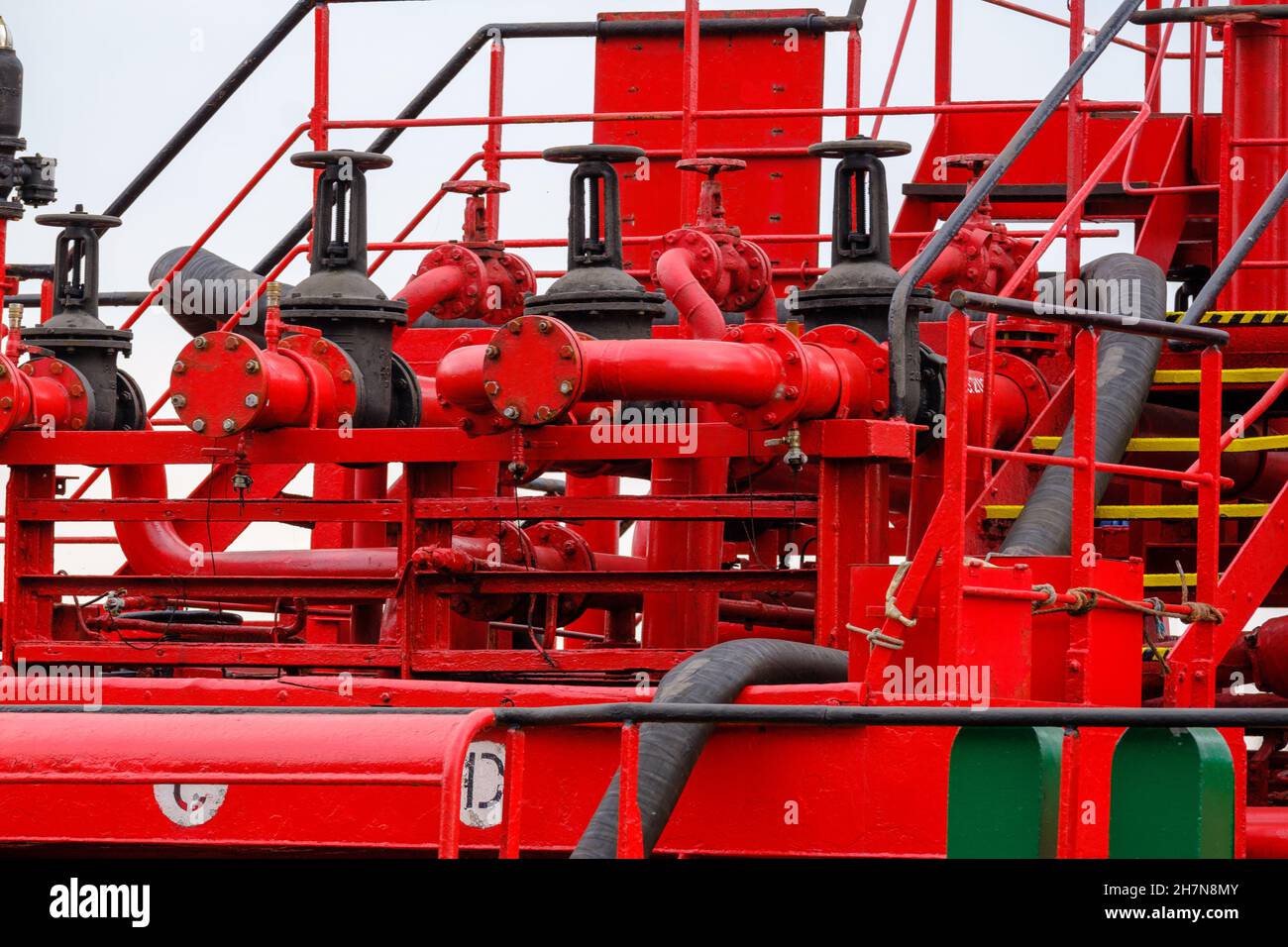 Red pipes outside industrial ship Stock Photo - Alamy