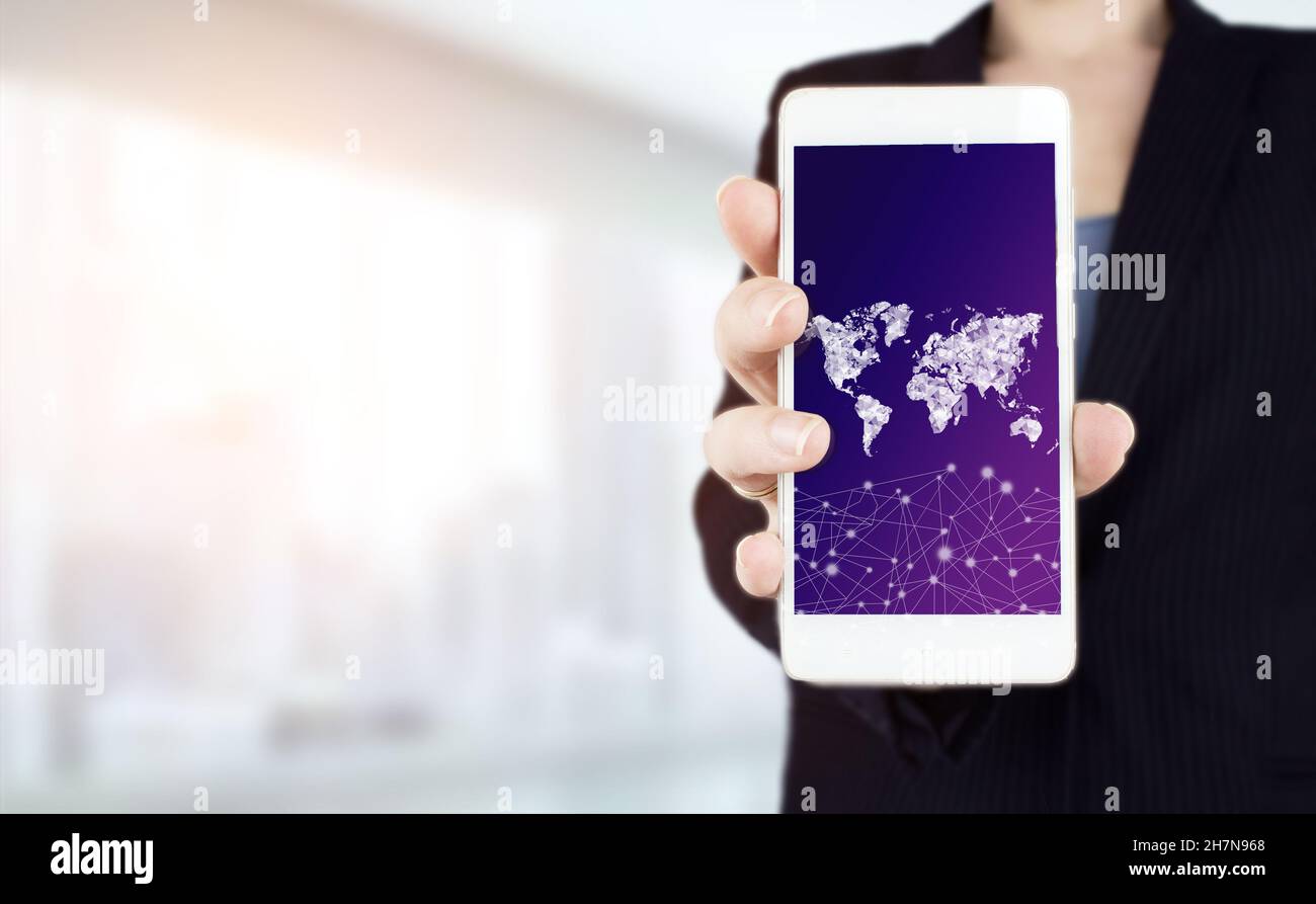 Global connection concept. Hand hold white smartphone with digital hologram world, earth, map ...