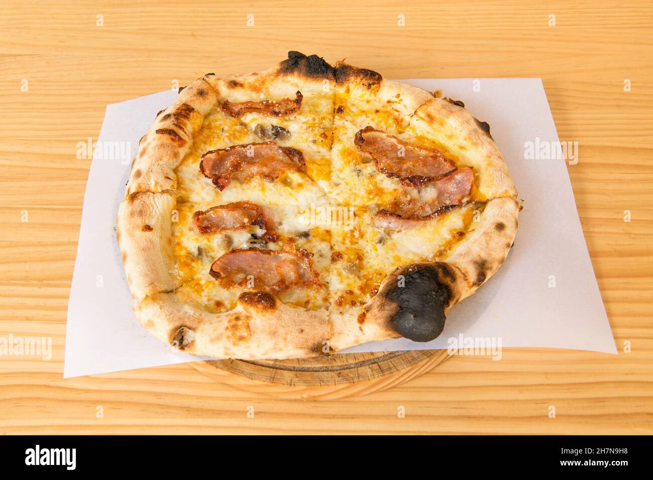 Guanciale pizza with mushrooms. Ingredients: Tomato sauce, mozzarella ...