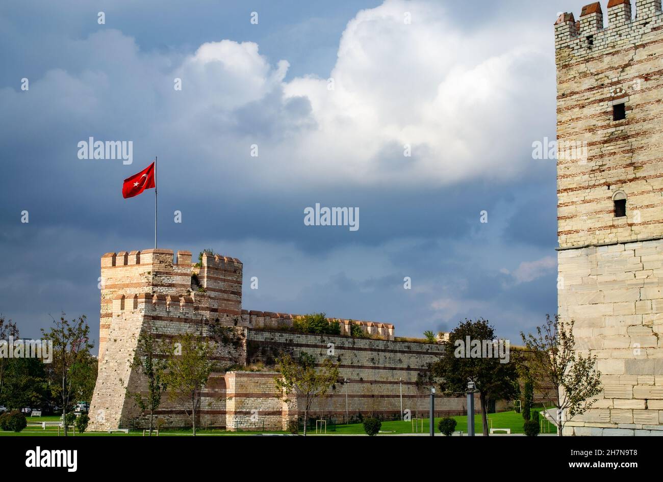 Red turkish flag on castle, turkish flag on top of the stone wall ...