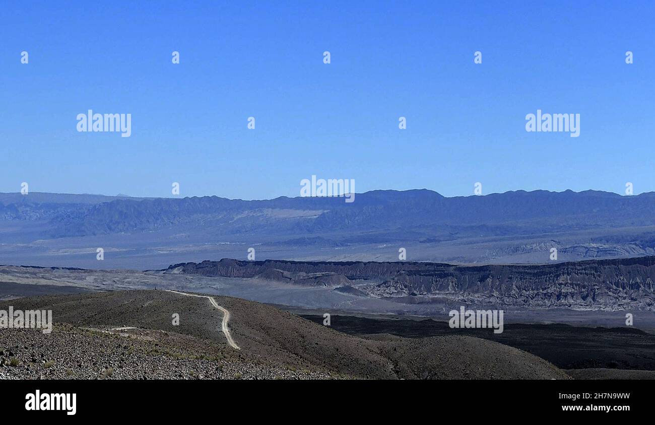 Landscape of hills under the sunlight and a blue sky in the Atacama ...