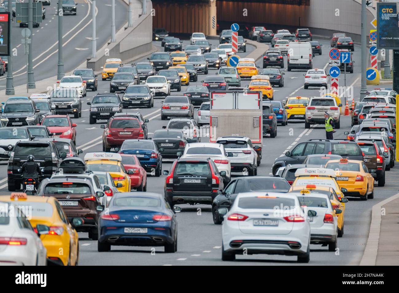Traffic on a multi-lane road in big city center downtown, day time ...