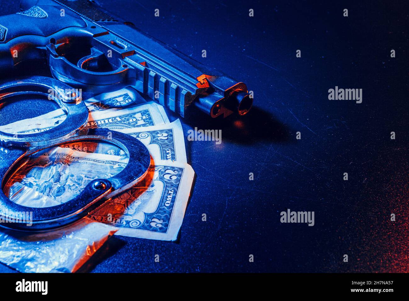 Gun and judge's gavel on the table. Crime, robbery, attack concept ...