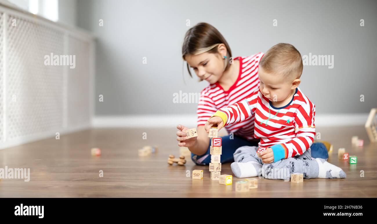 Brother sister sibling playing together hi-res stock photography and ...