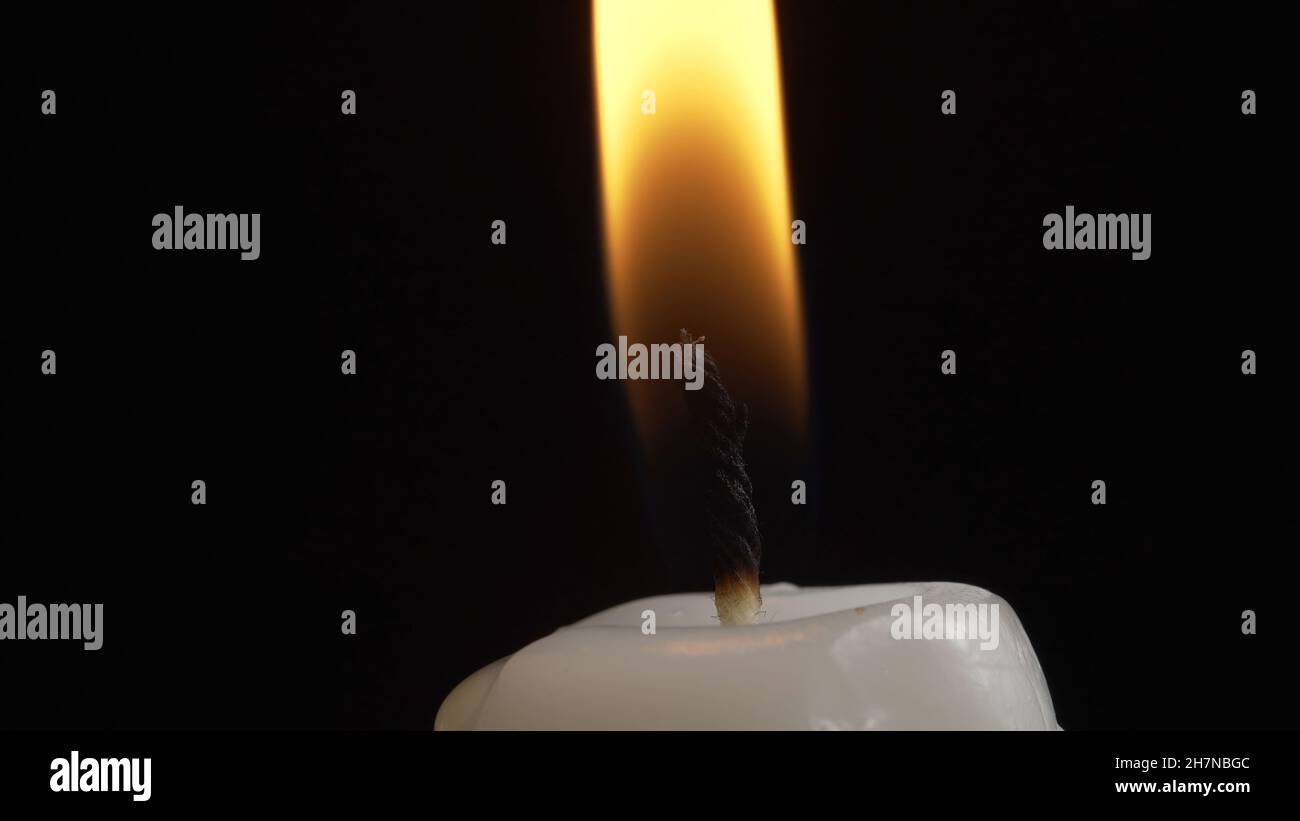 Shooting of lightening a candle on black background Stock Photo - Alamy