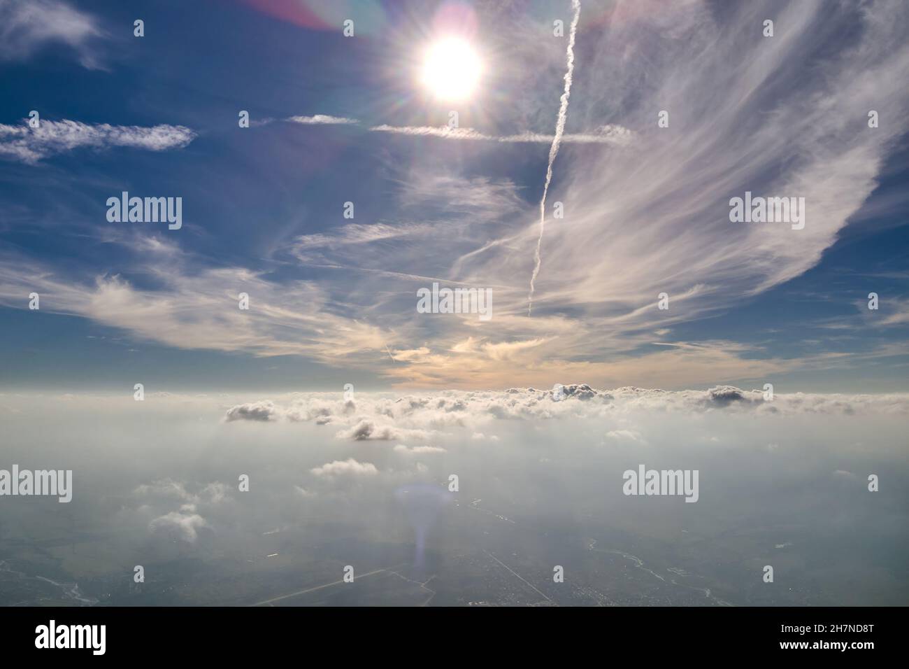 Aerial view from airplane window at high altitude of earth covered with ...