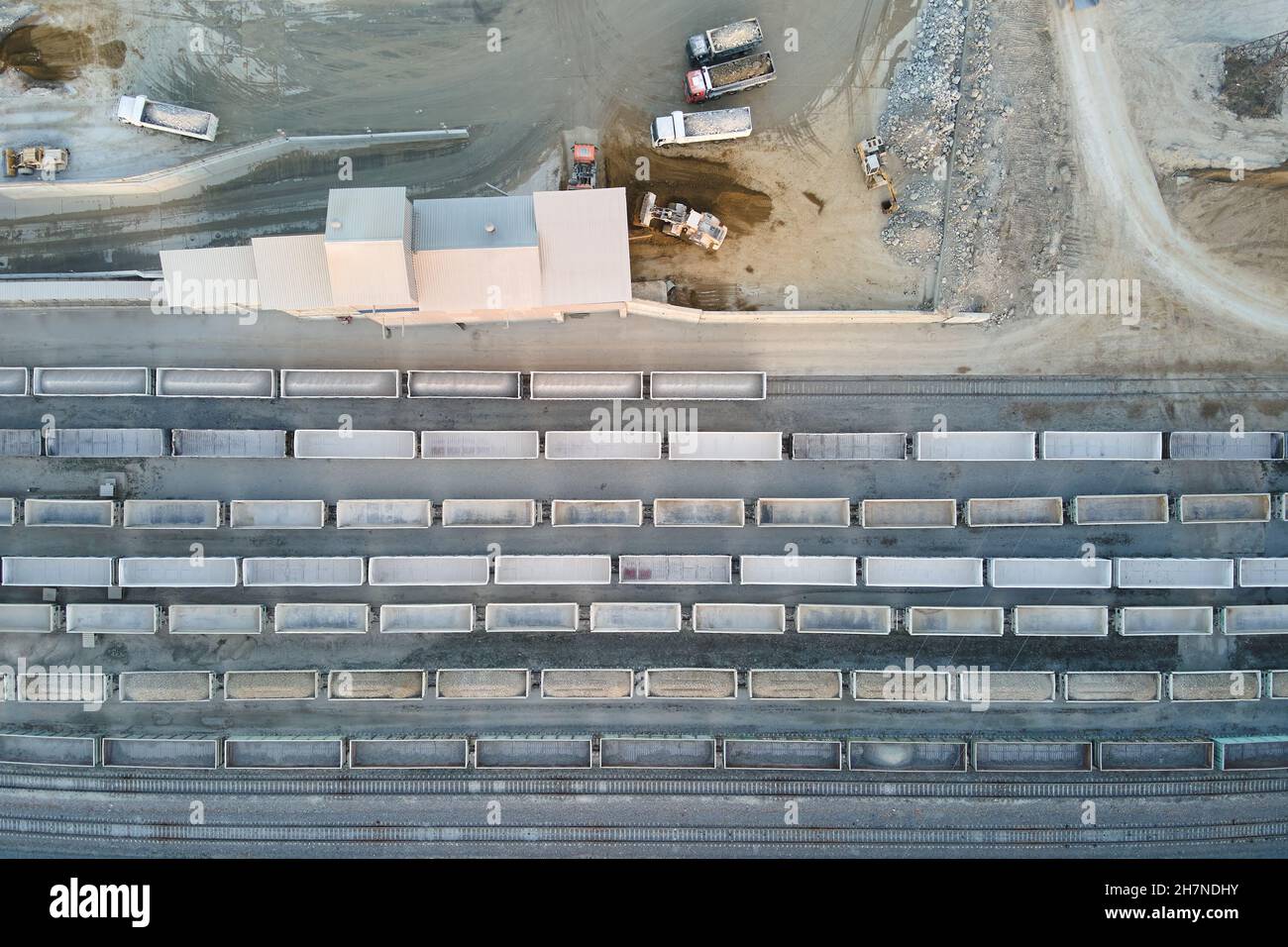 Aerial view of cargo train loaded with crushed stone materials at ...