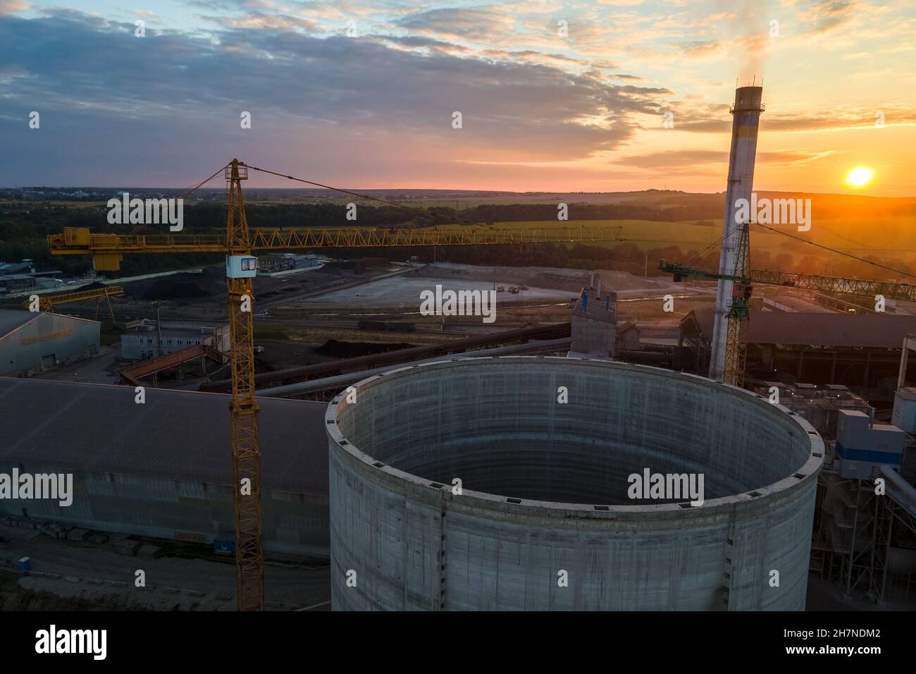 Aerial view of cement factory with high concrete plant structure and ...