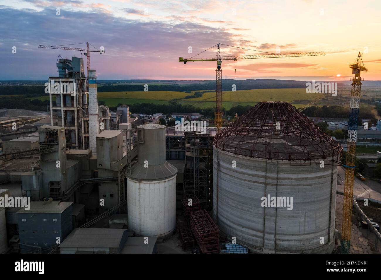 Aerial view of cement factory under construction with high concrete ...