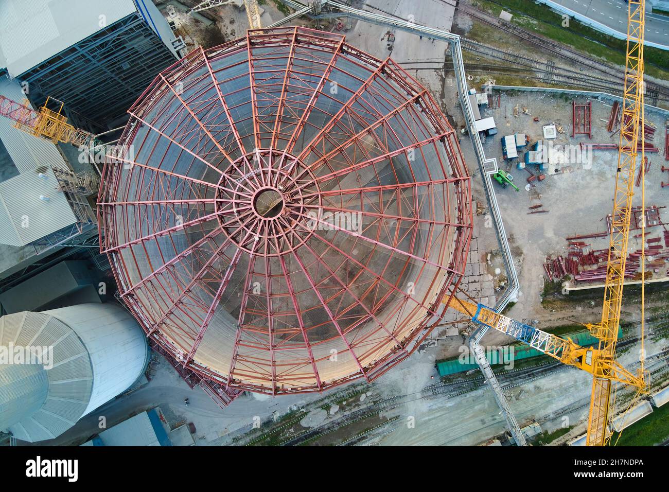 Aerial view of cement factory under construction with high concrete ...