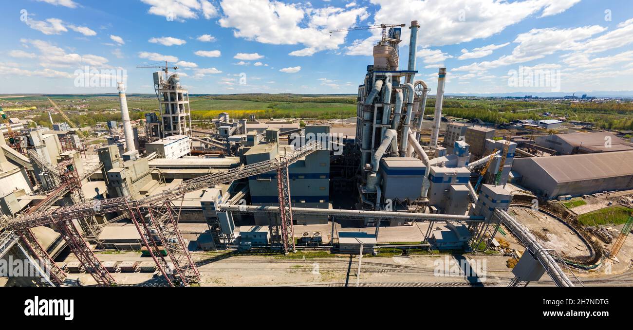 Aerial view of cement factory with high concrete structure and tower ...