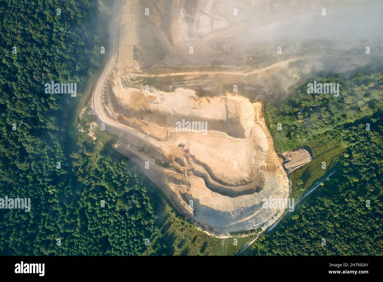 Aerial view of open pit mining of limestone materials for construction ...