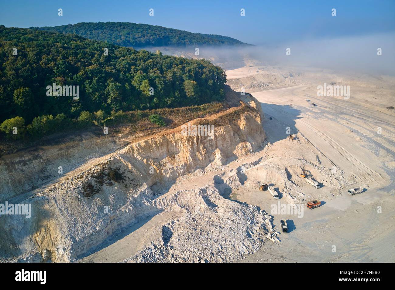 Aerial view of open pit mining site of limestone materials extraction ...