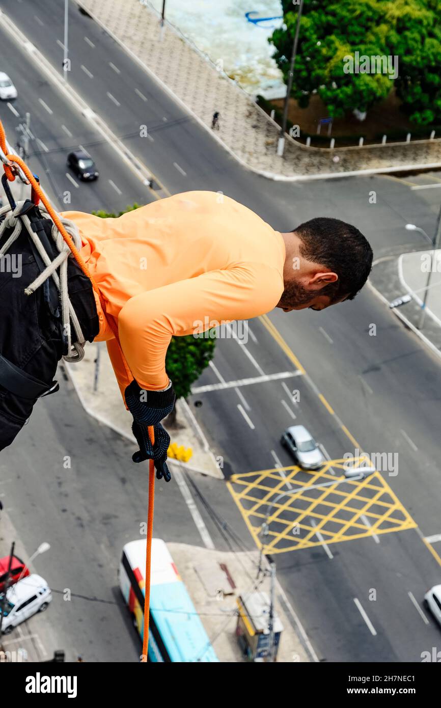 By rappelling down building hi-res stock photography and images - Alamy