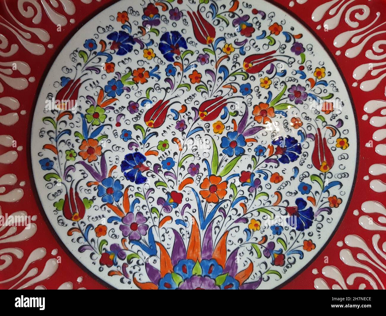 Indian hand-painted porcelain plate with flower designs Stock Photo - Alamy