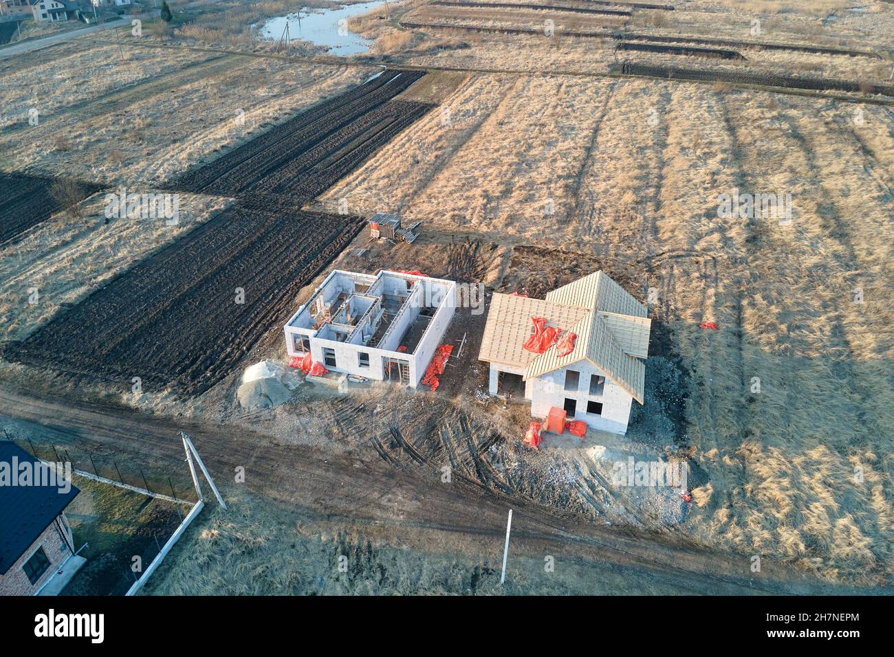 Aerial view of unfinished frame of private house foundation under ...