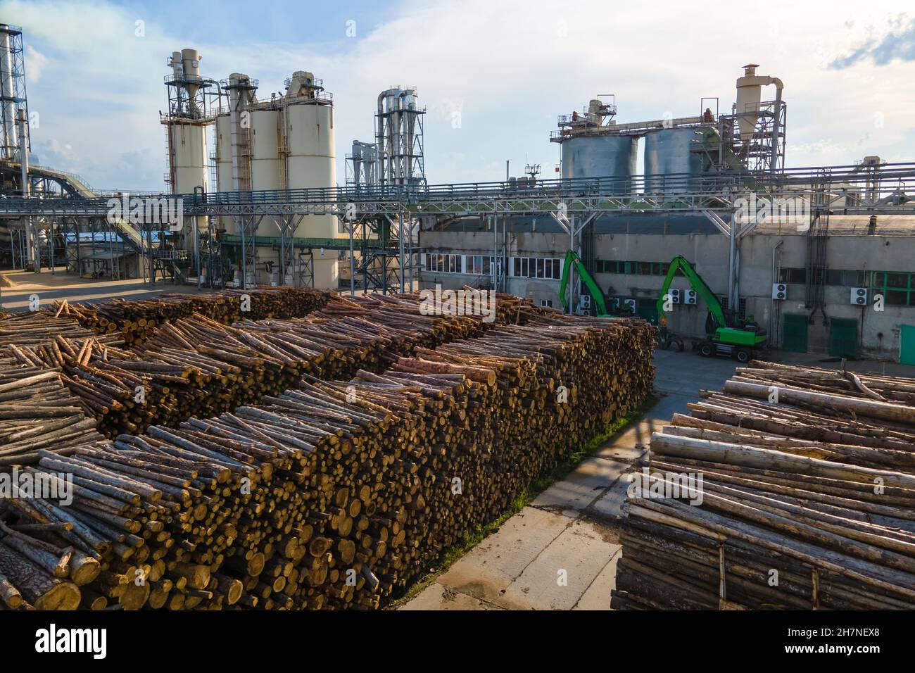 Aerial view of wood processing factory with stacks of lumber at plant ...