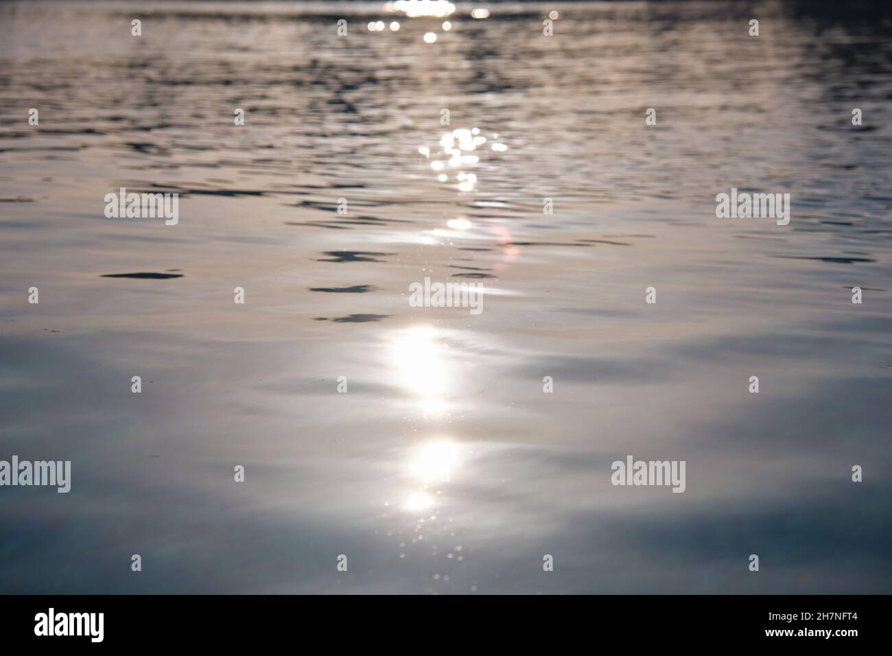 Closeup surface of blue clear water with small ripple waves in swimming ...