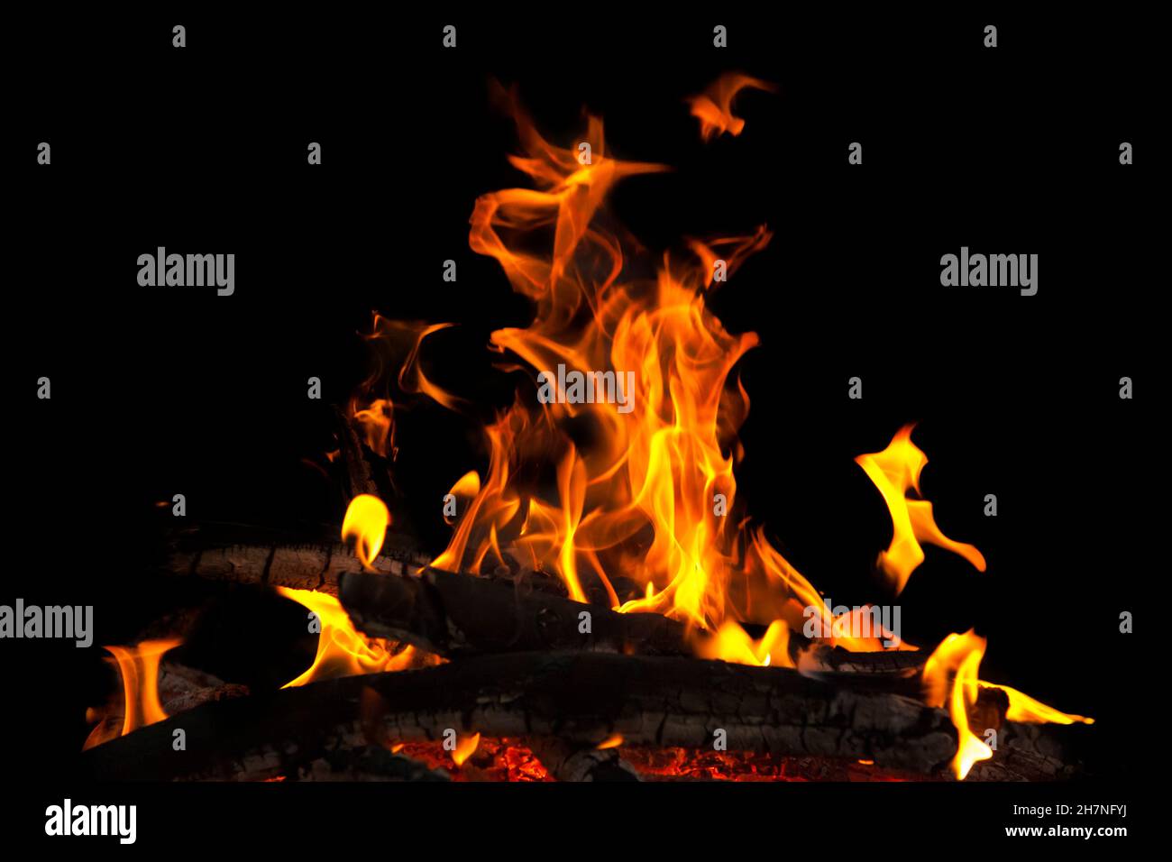A camp fire burning, outdoor night scene over black Stock Photo - Alamy
