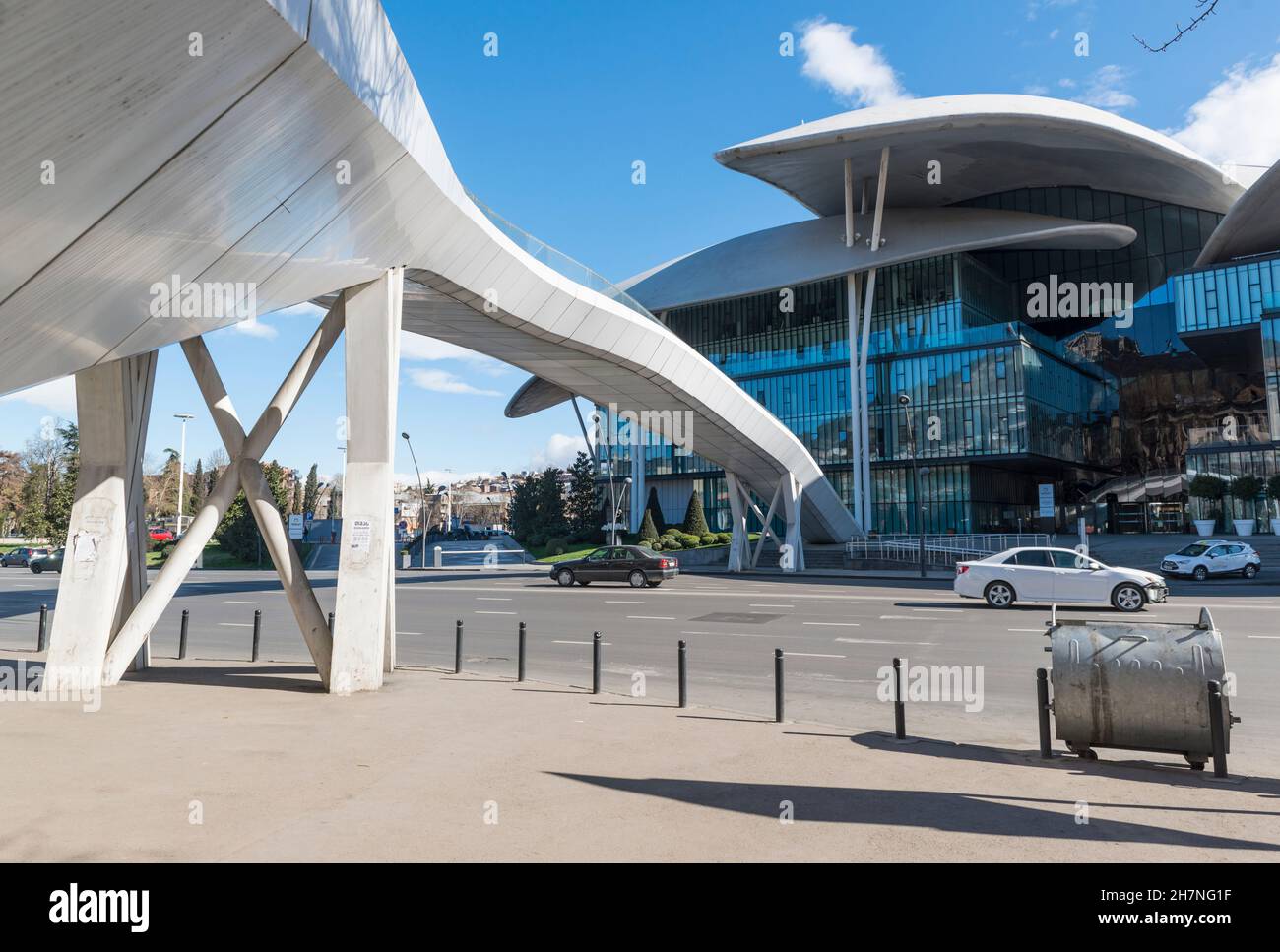 Modern architecture in Tblisi: A white pedestrian bridge leading to the ...