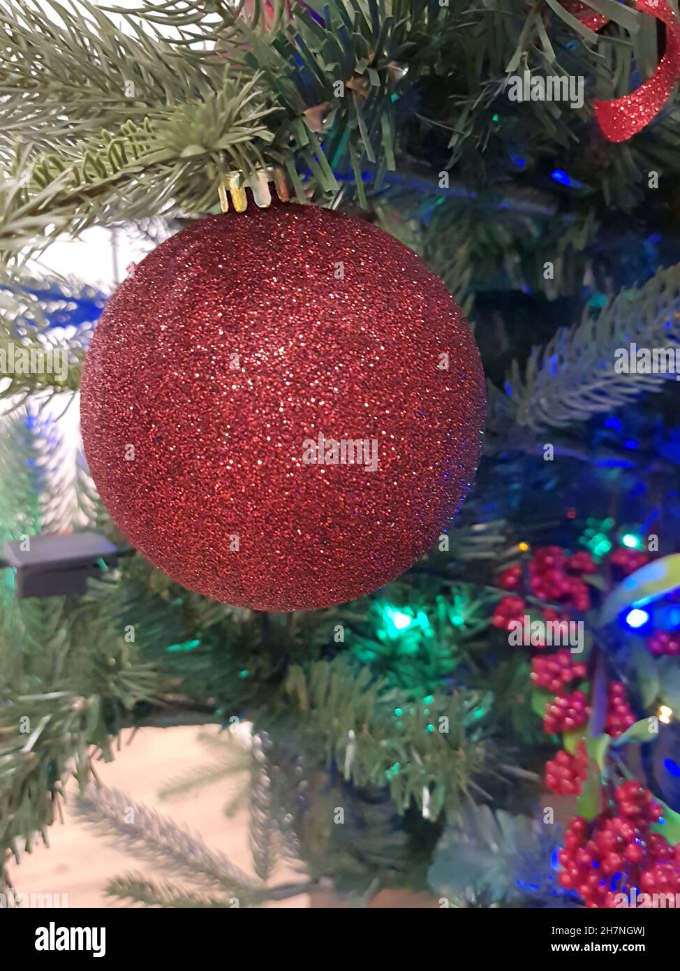 Christmas tree decorated with red baubles Stock Photo - Alamy