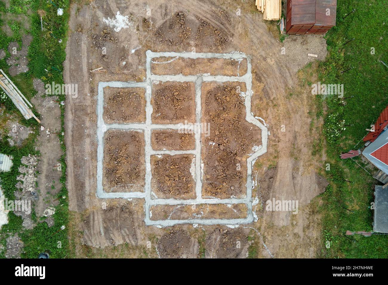 Top down aerial view of building works of new house concrete foundation ...