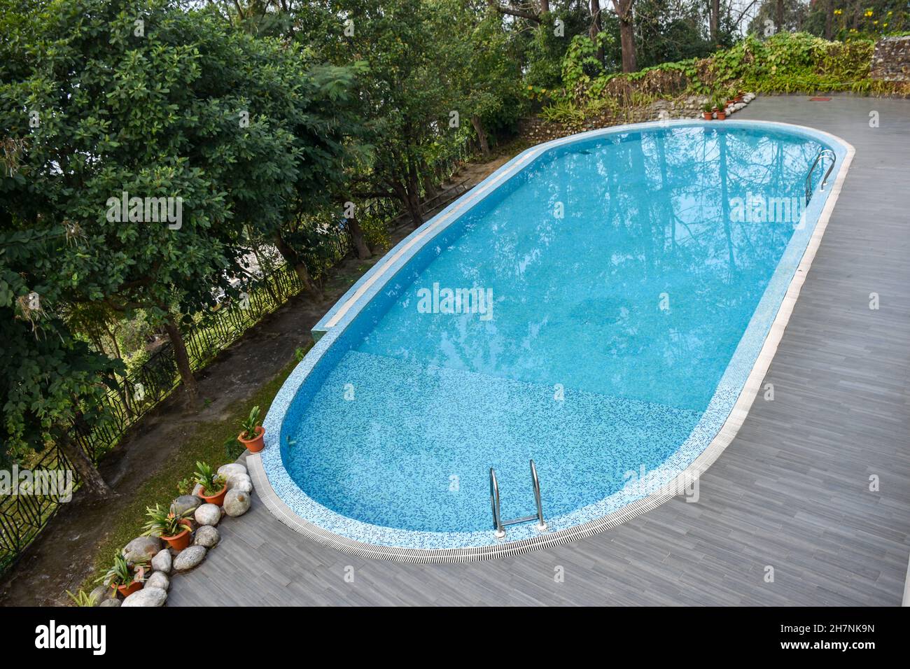 Swimming pool with blue and clear water Stock Photo - Alamy