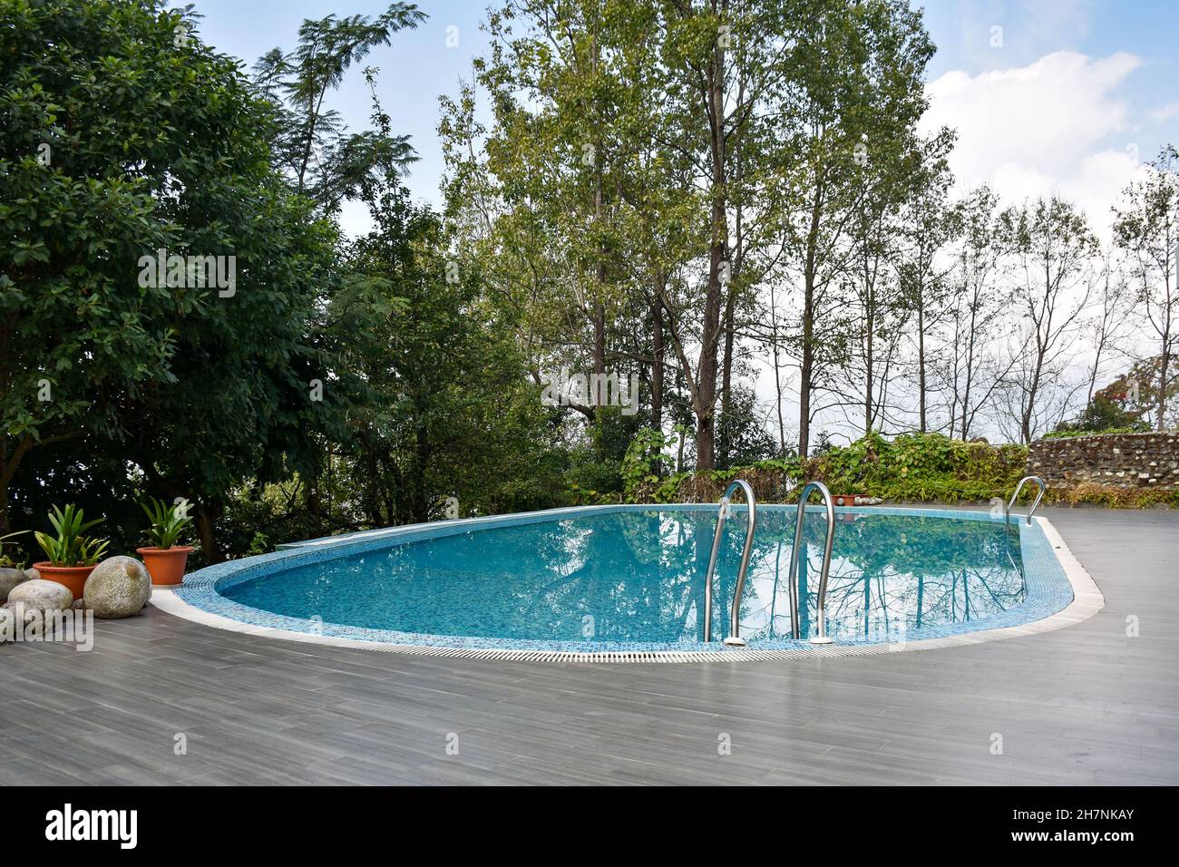 Swimming pool with blue and clear water Stock Photo - Alamy