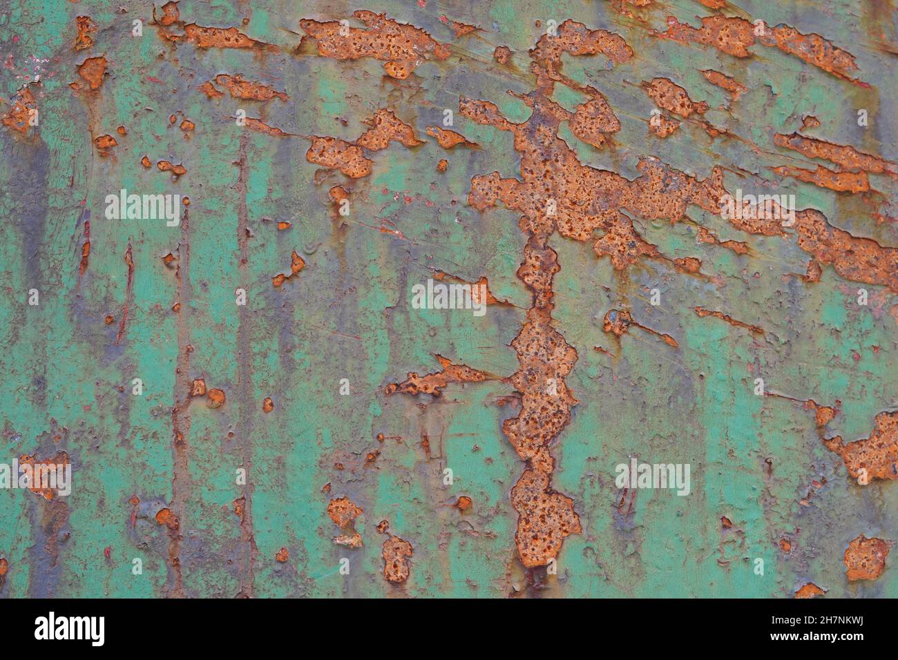 Rusted metal wall with layers of peeling paint. Backgrounds and ...