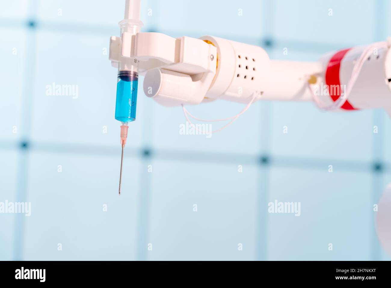 Robot hand with a medical syringe. Future medicine concept using robots ...