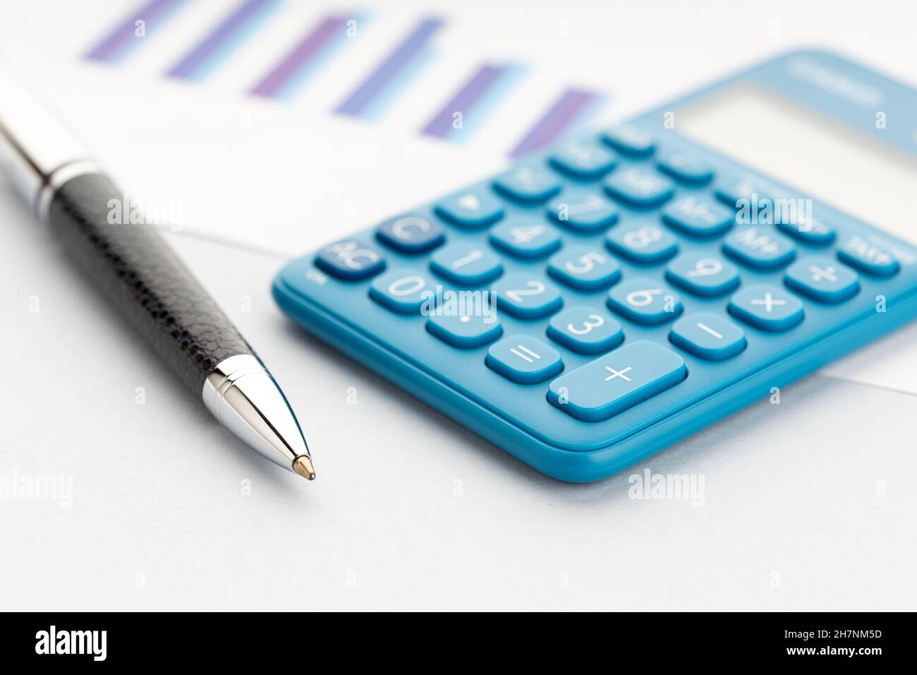 Business planning concept background. Calculator, pen and chart on ...