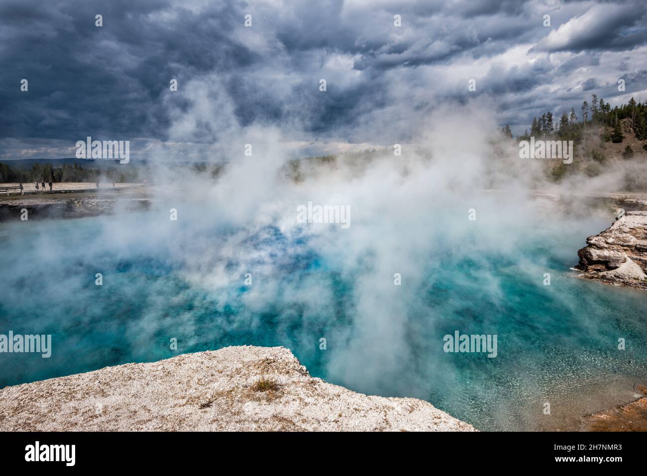 Storm clouds, steam rising from Excelsior Geyser Crater, now hot spring ...