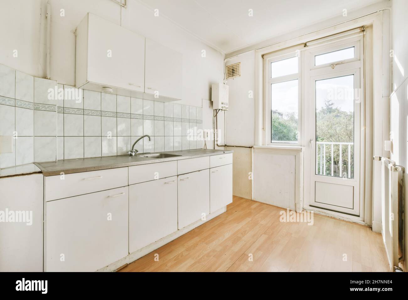 Small bright cozy kitchen in a beautiful apartment Stock Photo - Alamy