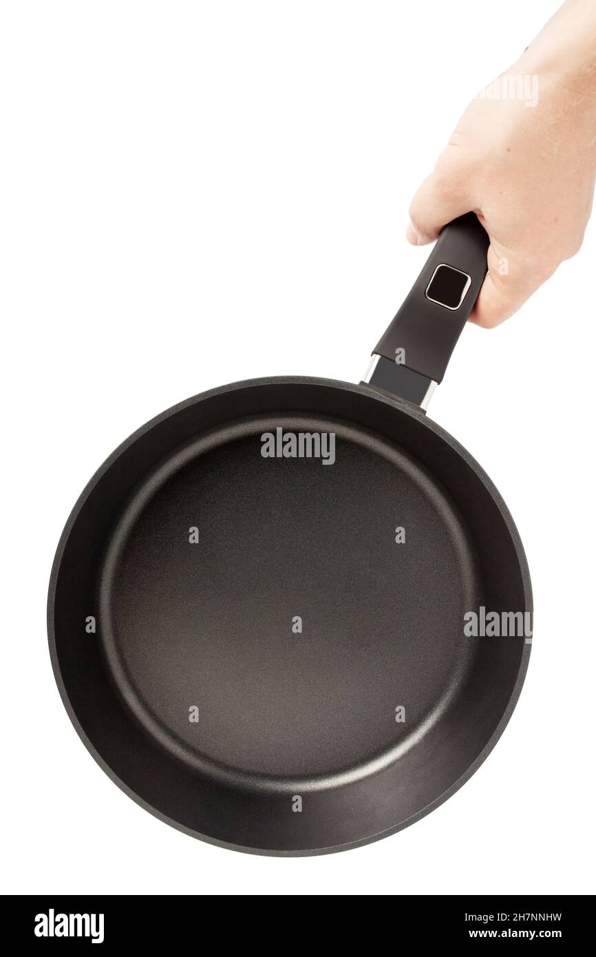 Male hand hold empty frying pan with non-stick coating isolated on ...