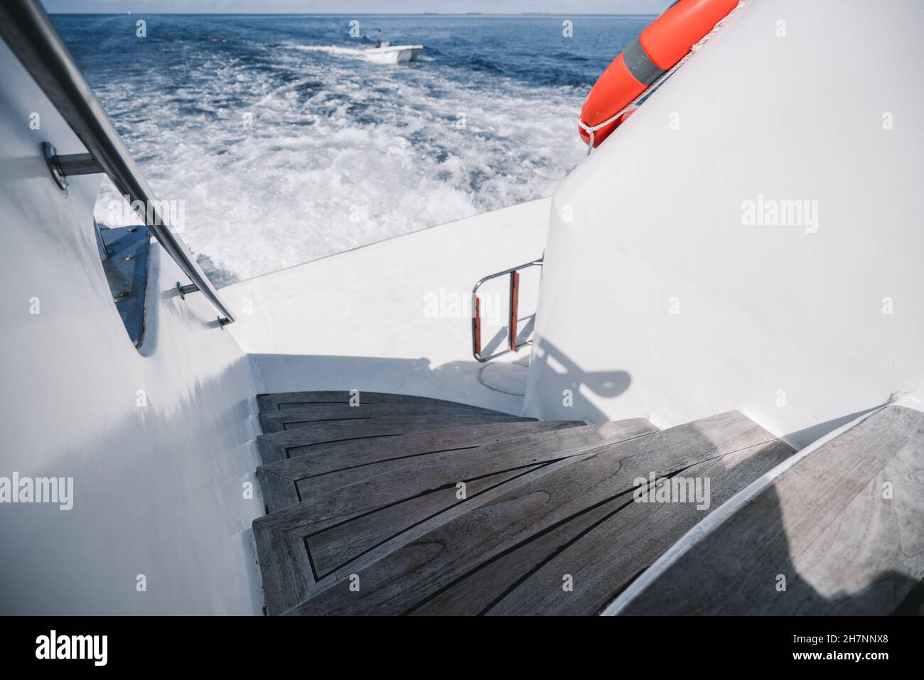 Wide-angle shot of a luxurious boat stern of the wake (wash) effect on ...