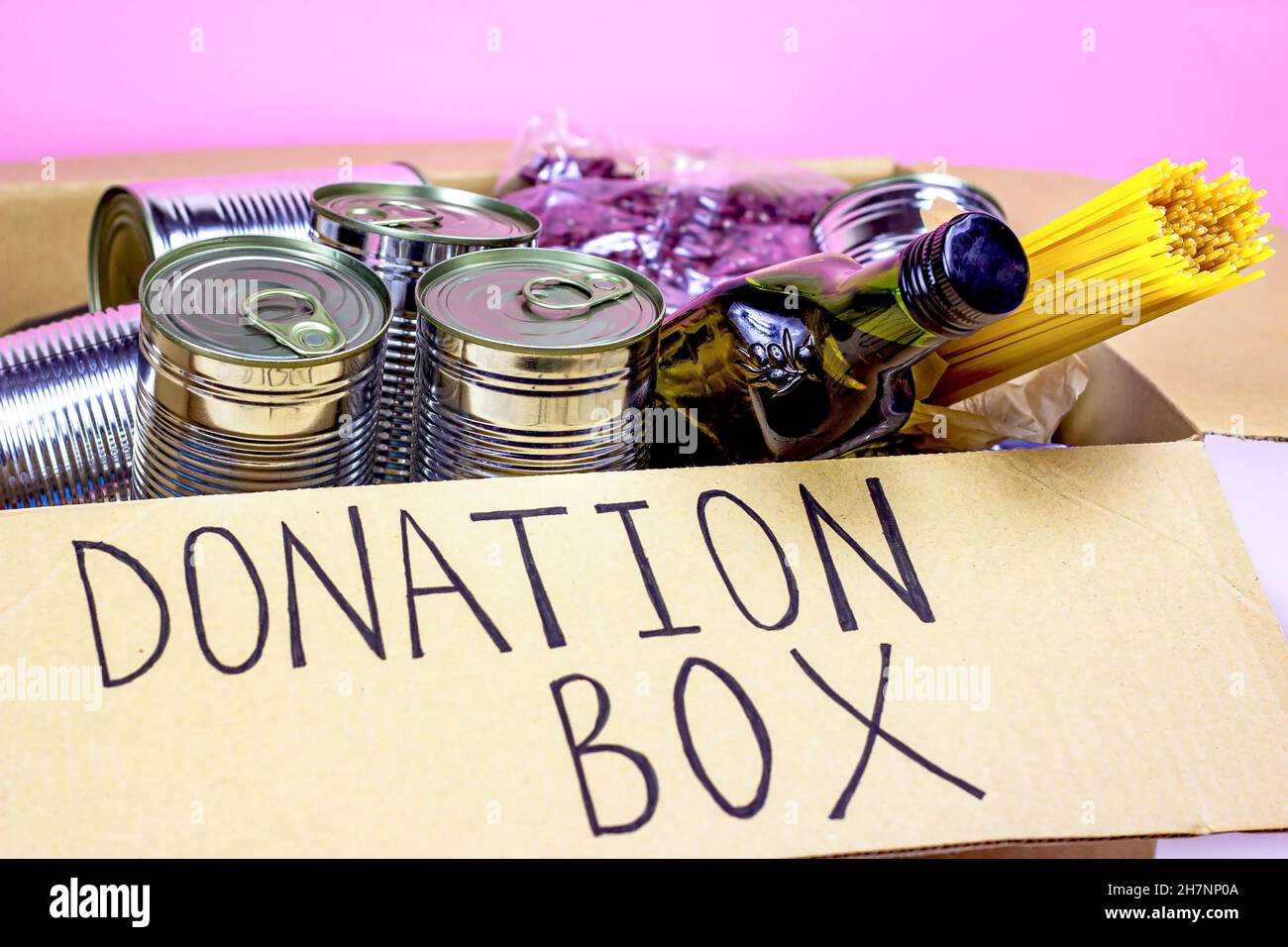 Donation carton box with food (pasta, cans, vegetables and other ...