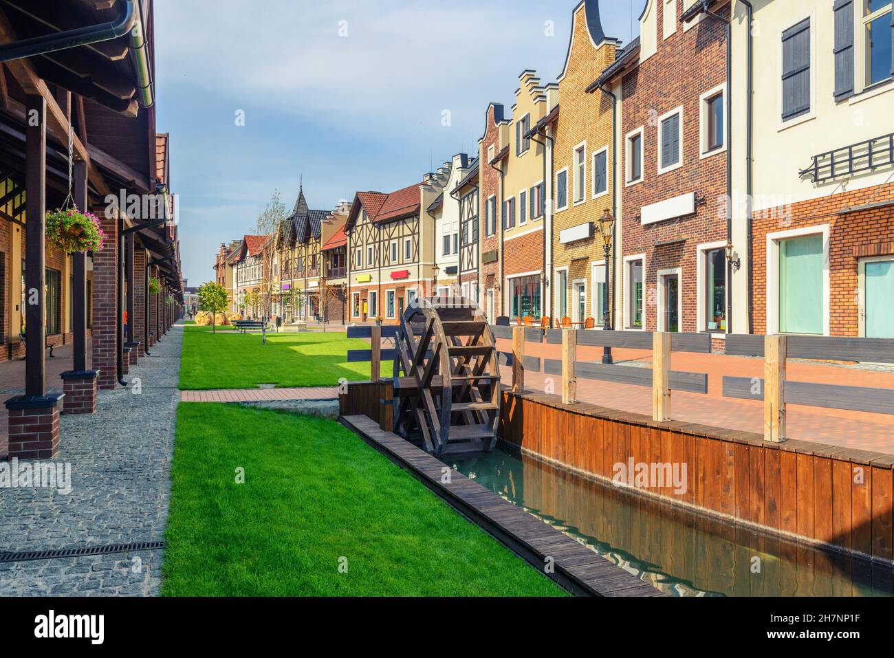 Streets of Dutch town with brick walls and water mill. A place to be ...