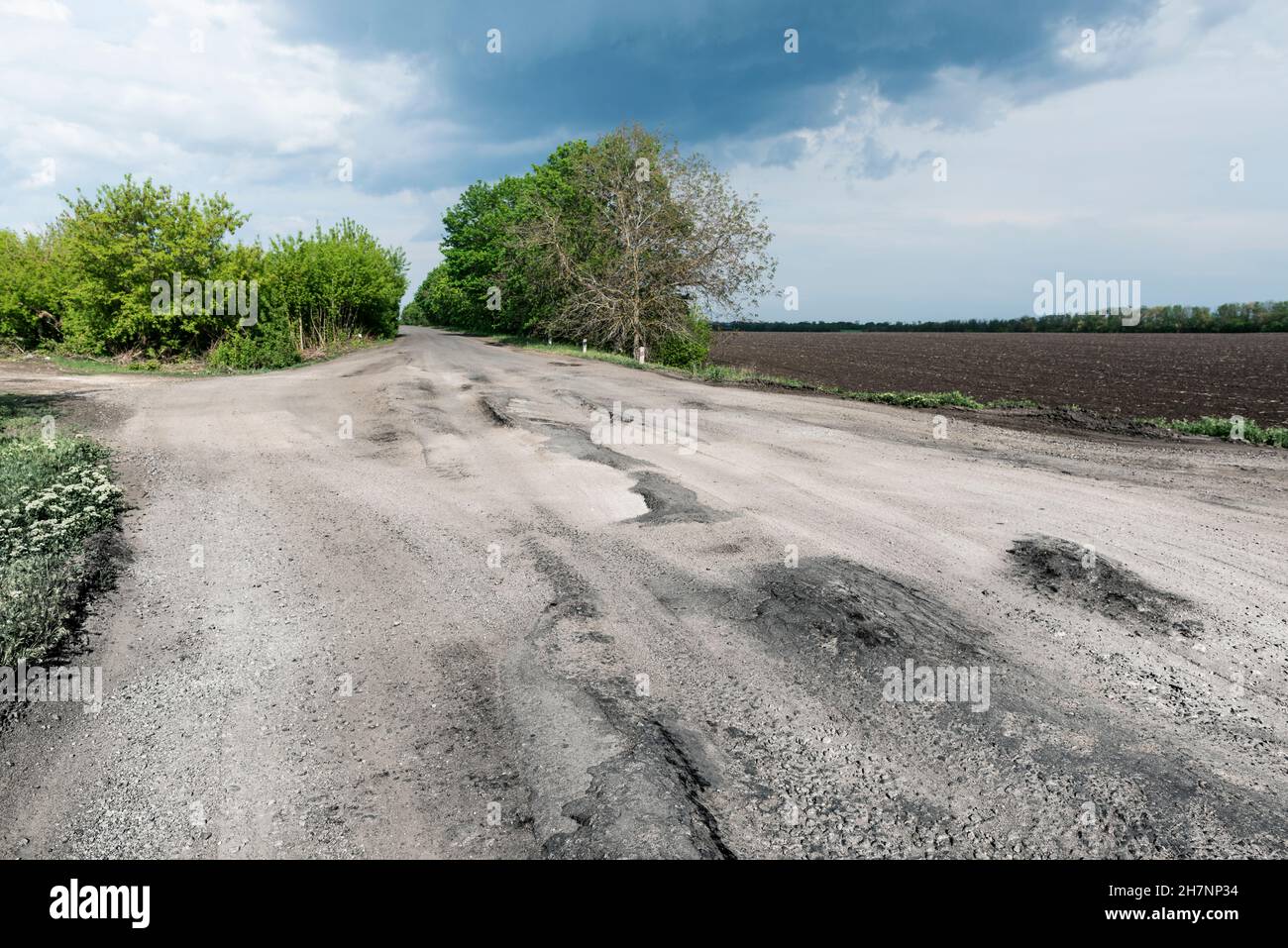 Extremely bad asphalt road. Destructed road at the countryside Stock ...