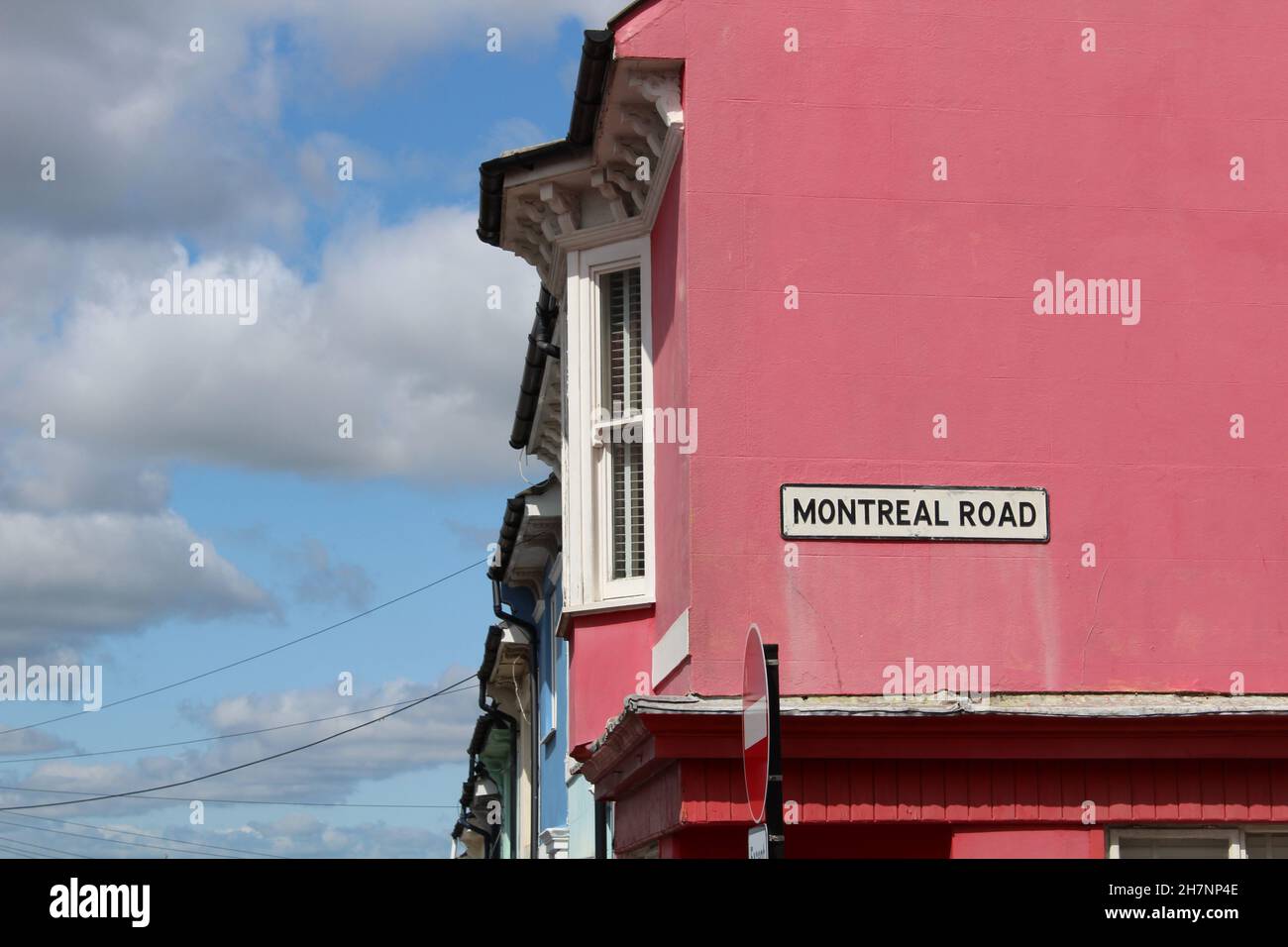 Pink terraced house set against the sky on Montreal Road, Brighton ...