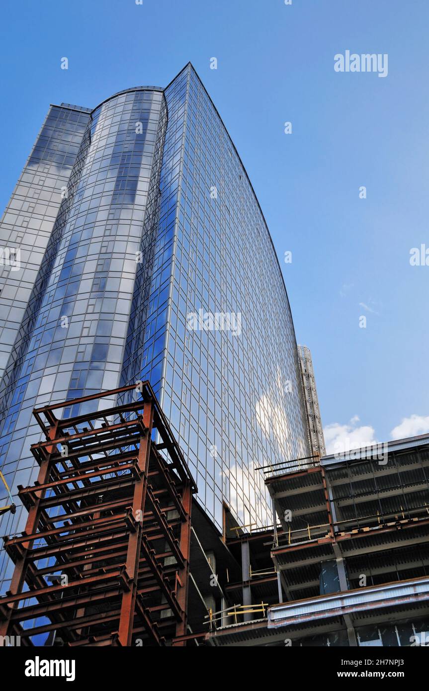 Big glass and steel business center under construction with sky ...