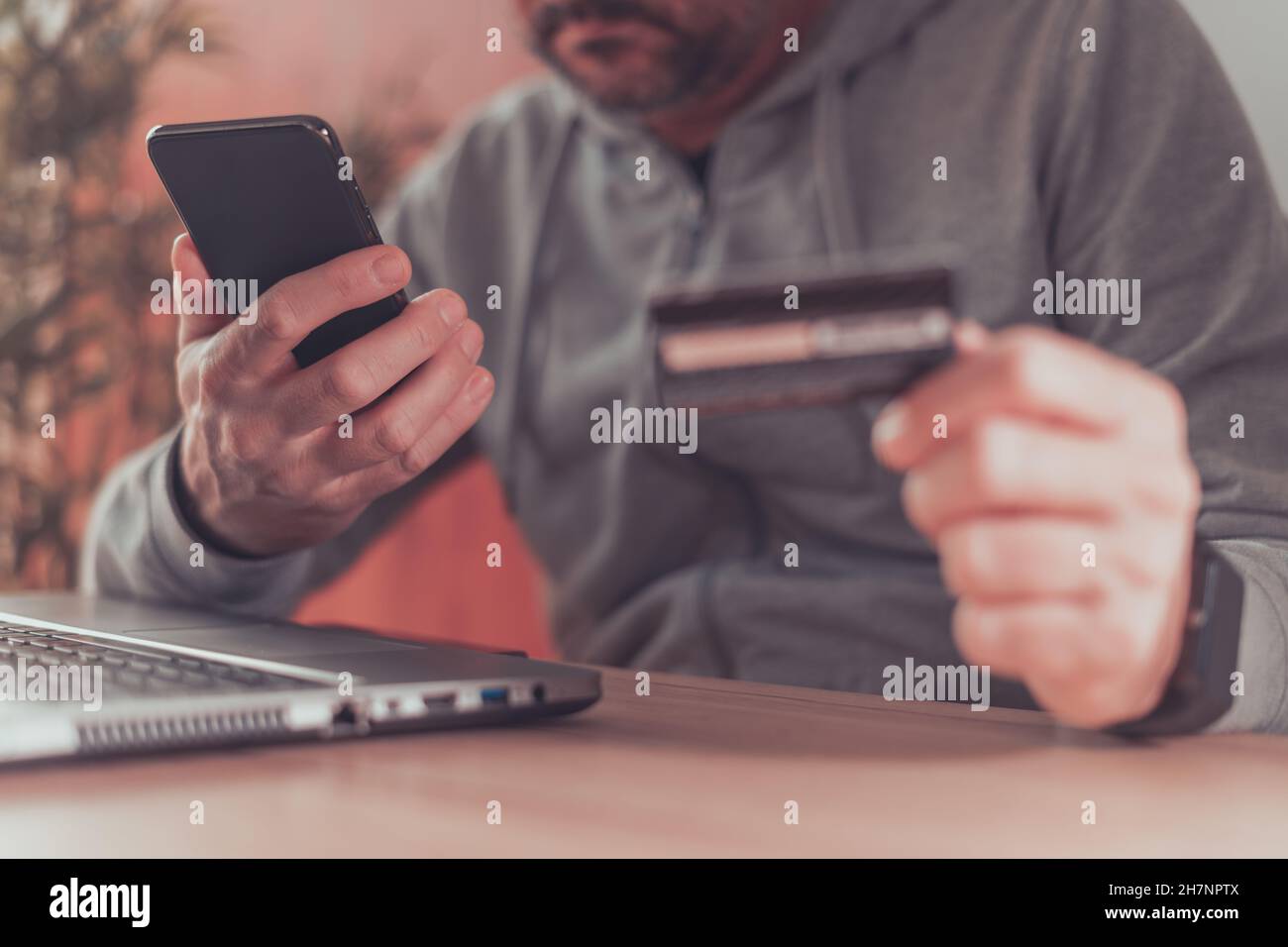 E-commerce and electronic banking concept, man using laptop computer ...