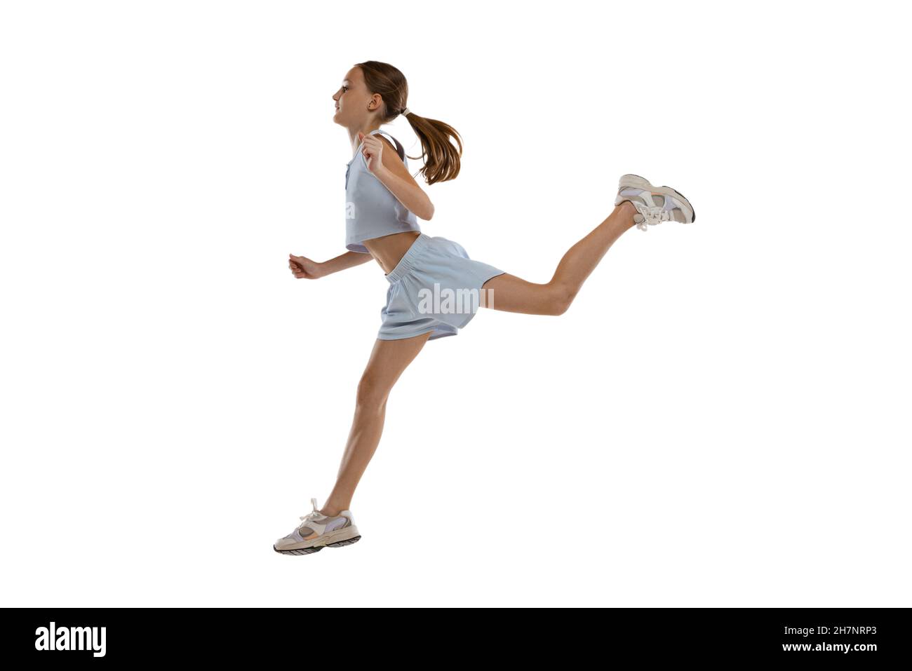 Full-length portrait of girl, teenager running, training isolated over ...